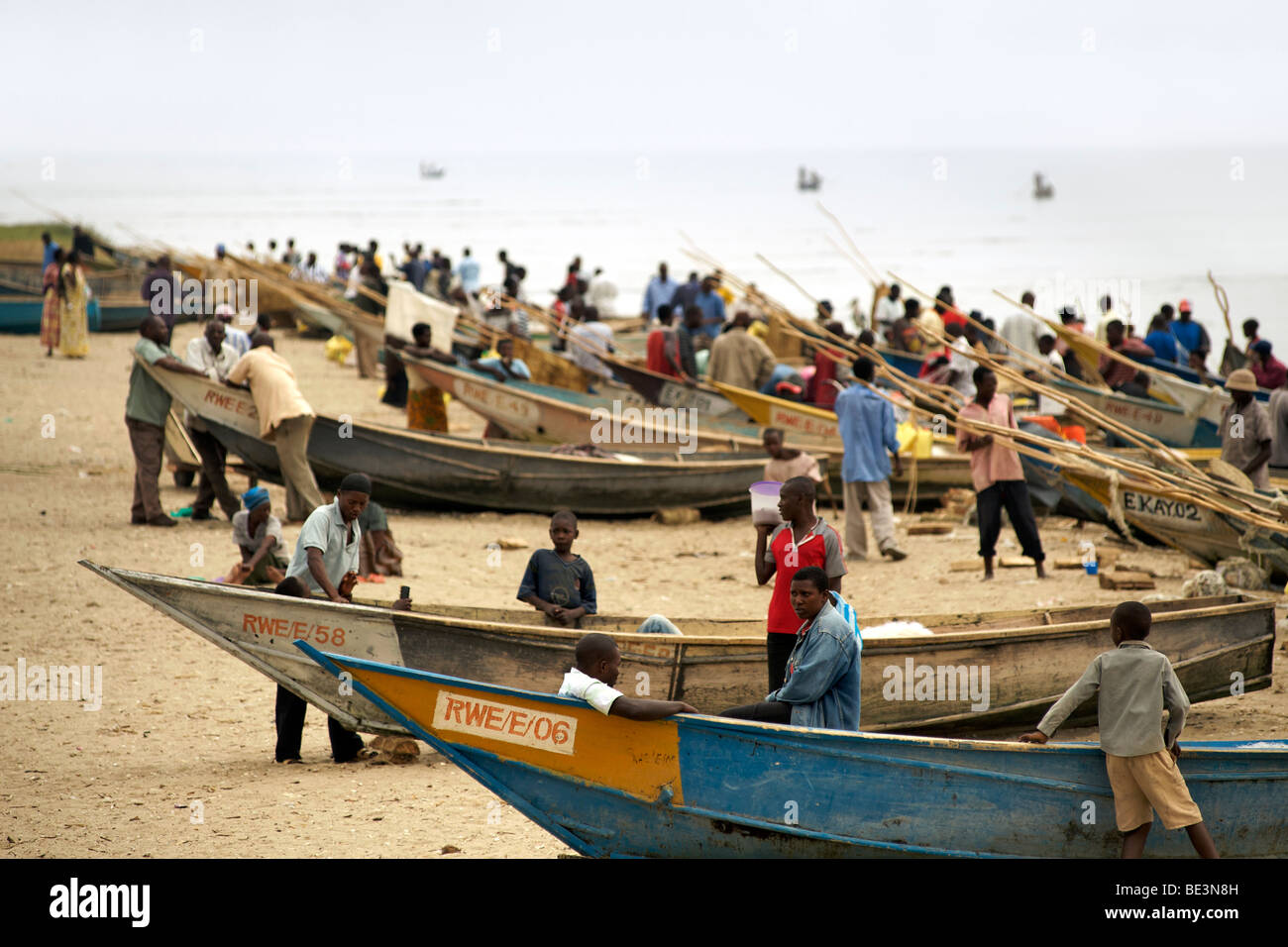 Ugandans with fishing boats in Rwenshama village on the edge of Lake ...