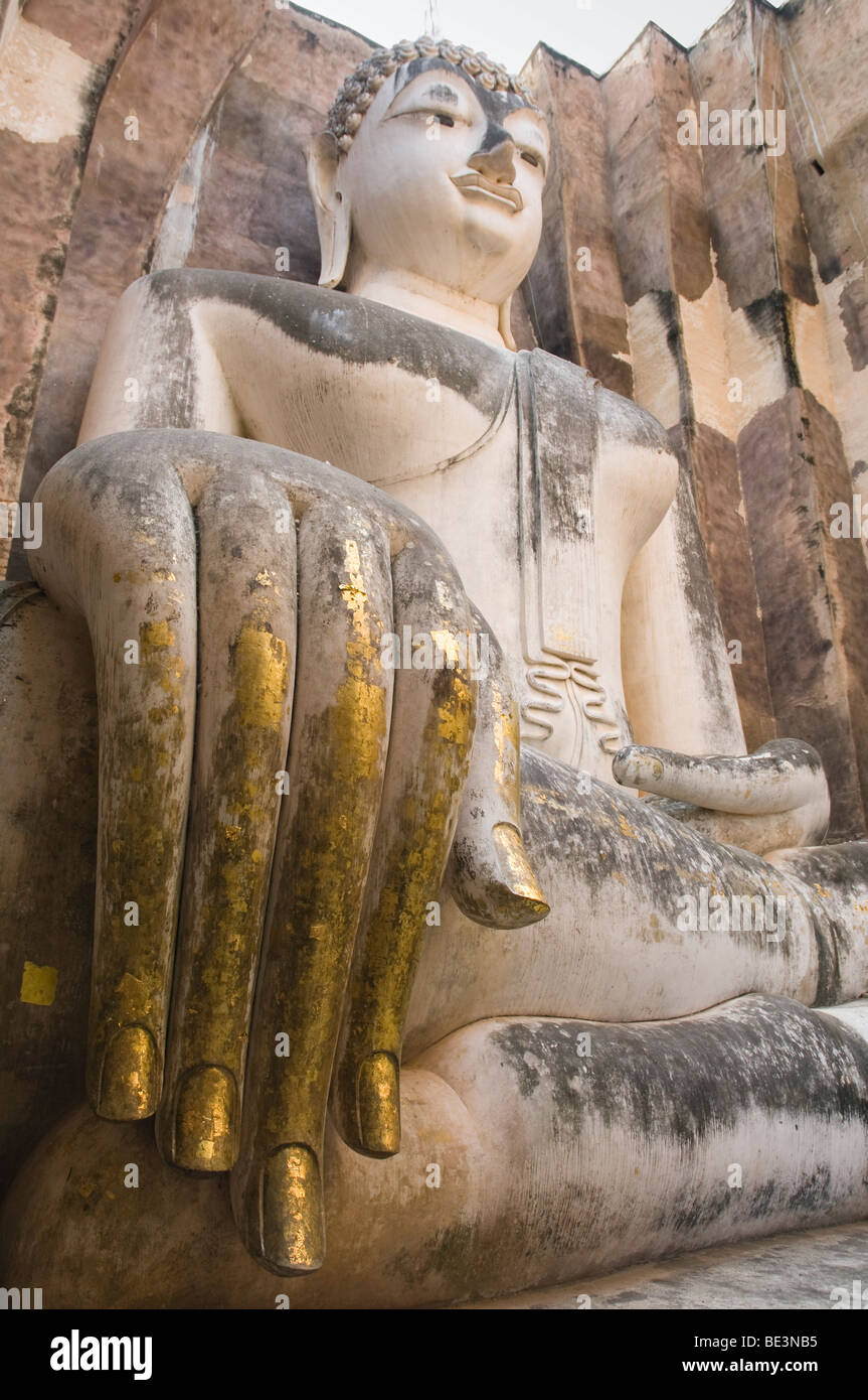 Gilded hand of the seated Buddha, Phra Atchana Buddha, Wat Si Chum ...