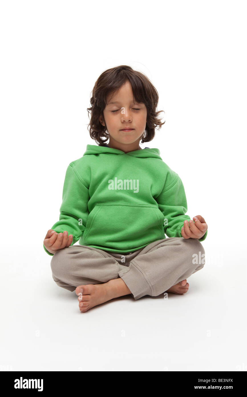 Little boy is sitting in a yoga lotus position Stock Photo - Alamy