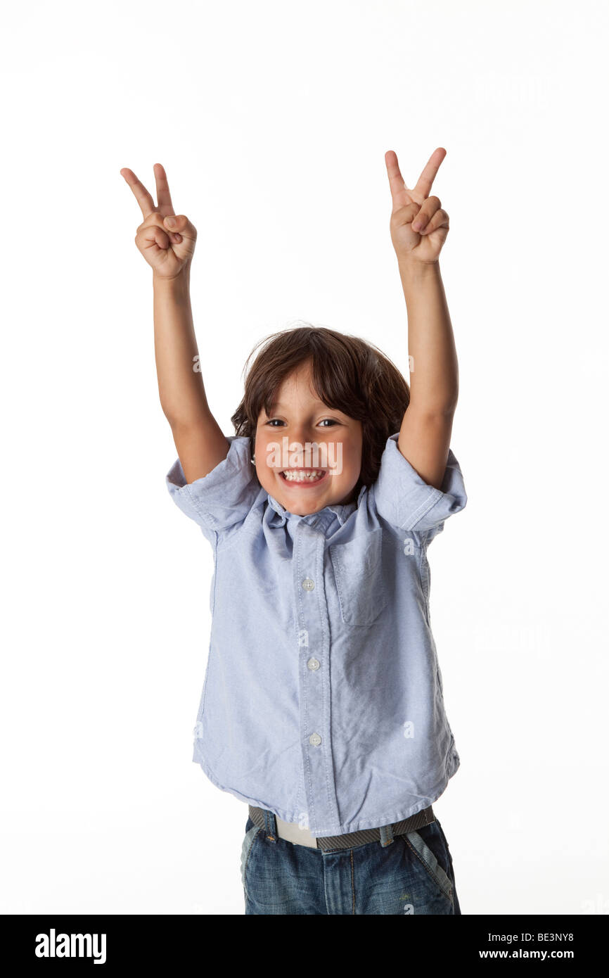 Happy little boy holding four fingers in the air Stock Photo - Alamy