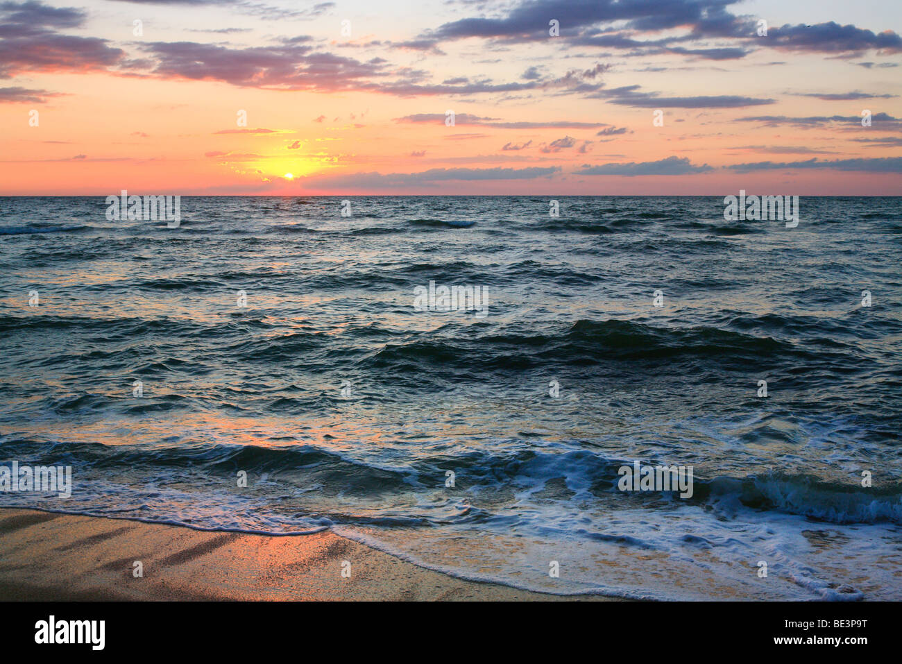 Sea sunset surf great wave break on coastline Stock Photo - Alamy