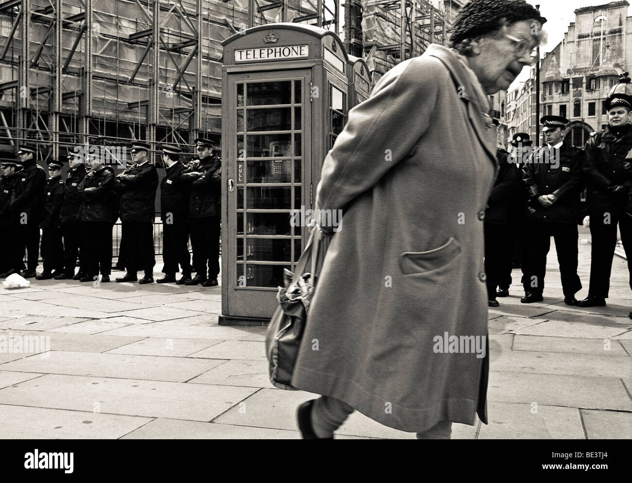 Old lady and riot police Stock Photo - Alamy