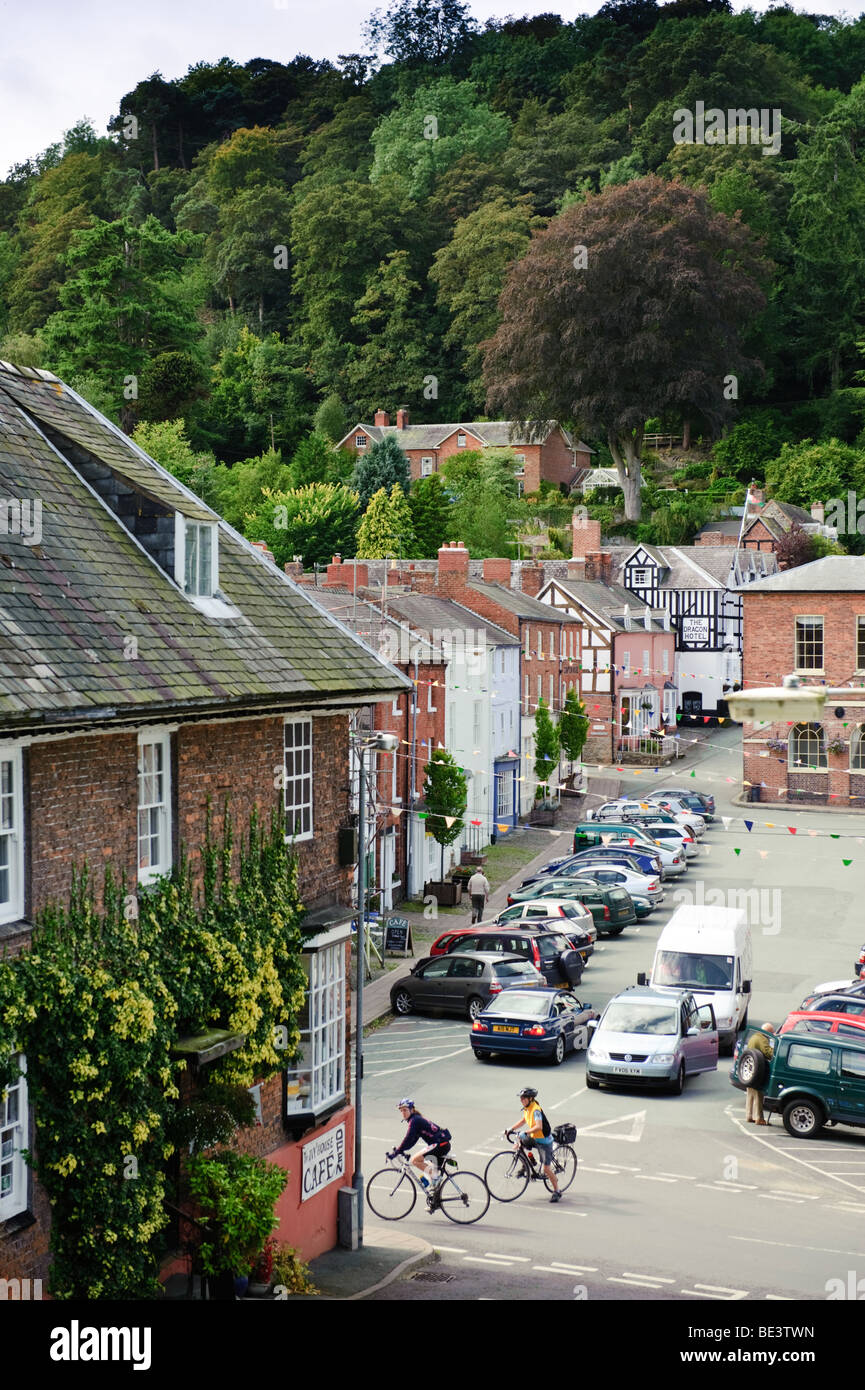two cyclists in Montgomery town centre, Powys, on the wales england ...