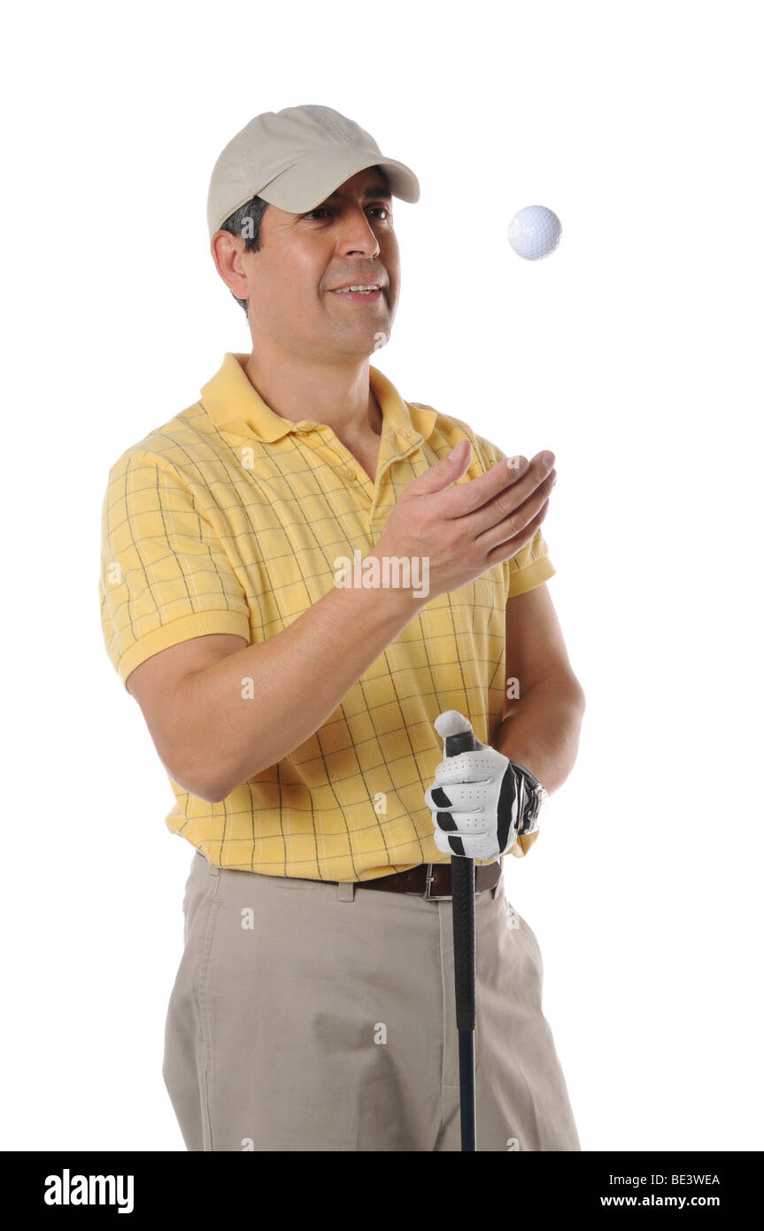 Golfer tossing a ball isolated on a white background Stock Photo - Alamy