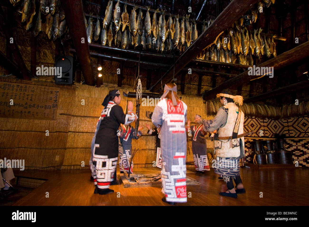 A group of Ainu perform a traditional dance to send the spirit of the ...