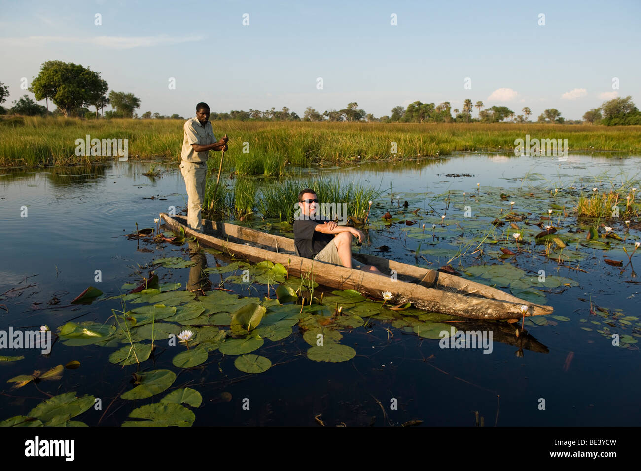 Tourist on mokoro trip, Okavango Delta, Botswana Stock Photo - Alamy