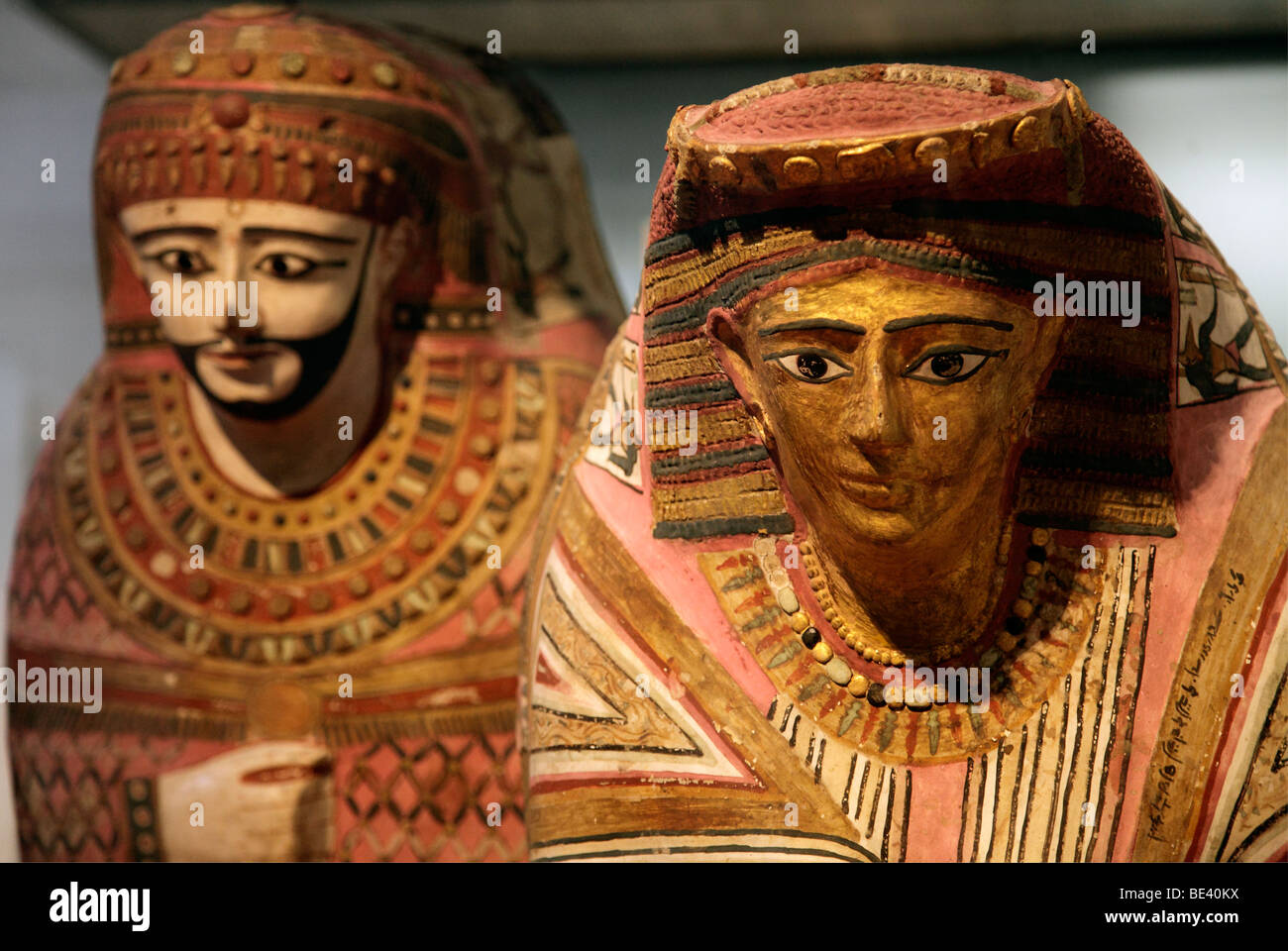Painted and gilded Egyptian mummy cases of a man and woman in the ...