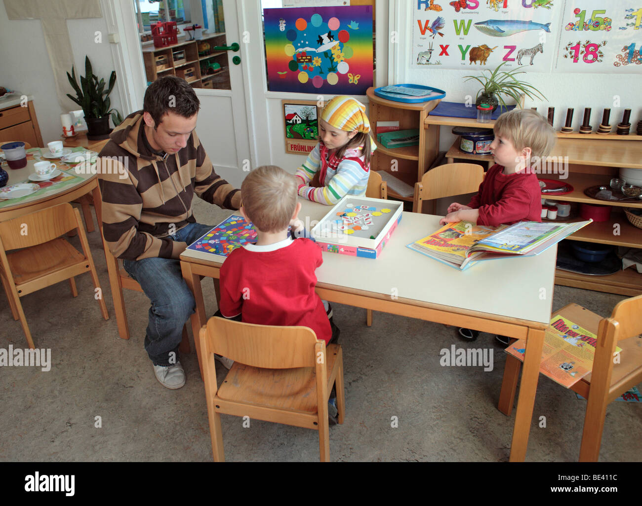 Children playing at day-care center Stock Photo - Alamy