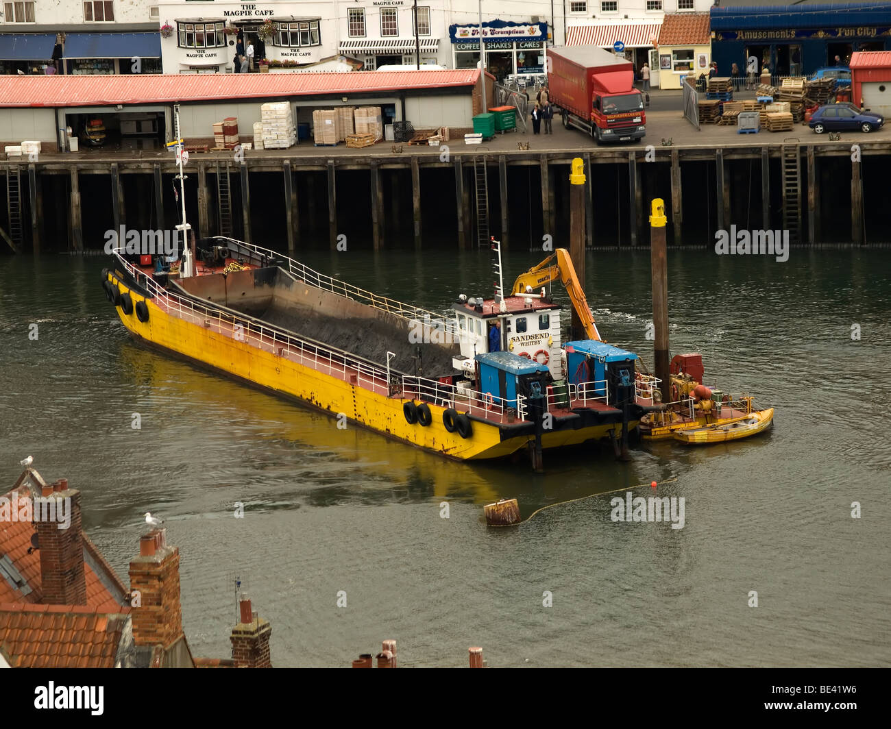 The dredging system in Whitby harbour Split hopper barge "Sandsend" and ...