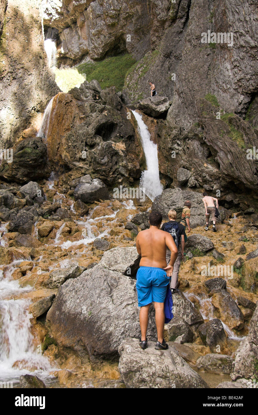 People climbing a waterfall, Gordale Scar, near Malham, Yorkshire Dales ...