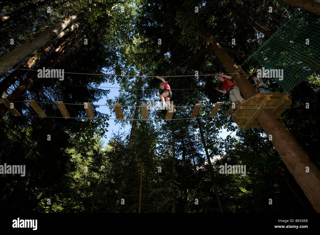 Young girl makes her way around a tree walking activity in the Chamonix ...