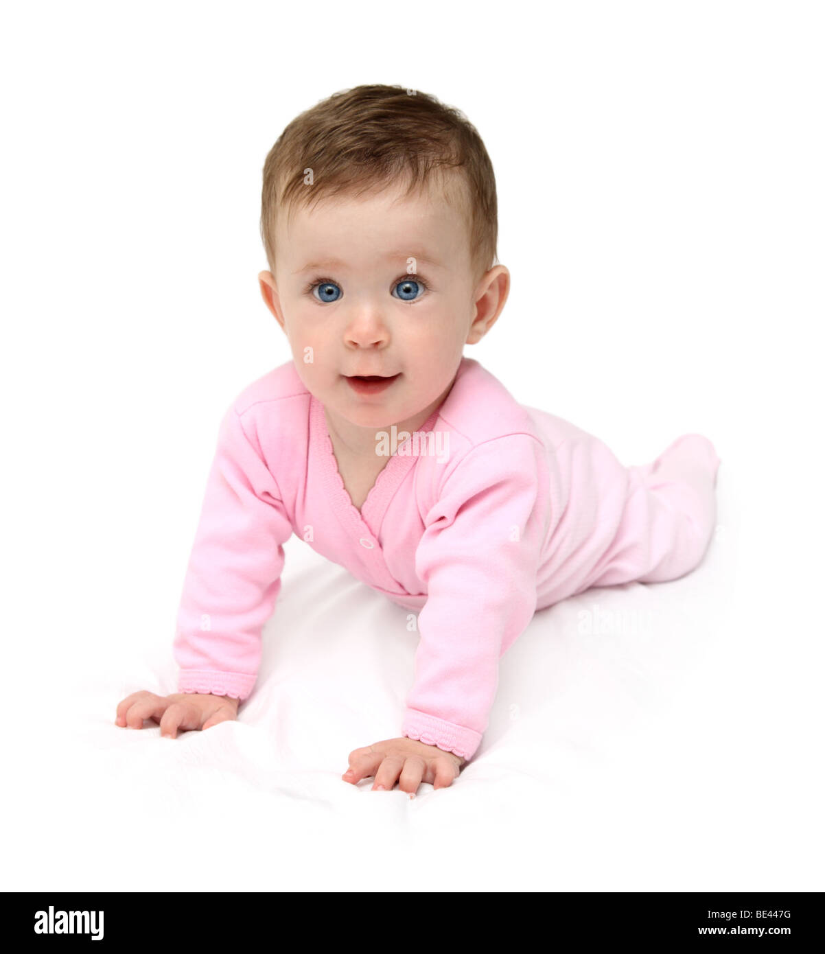 baby in pink crawling on white sheet Stock Photo - Alamy