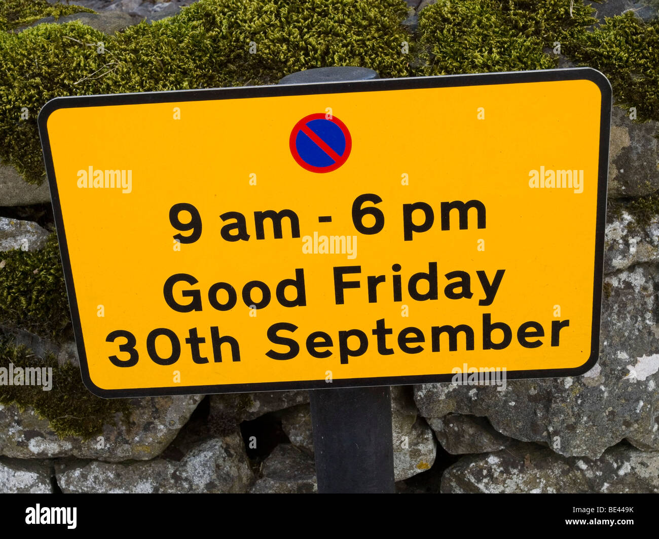 Close up of a bright yellow parking restriction sign in Hartington, the ...