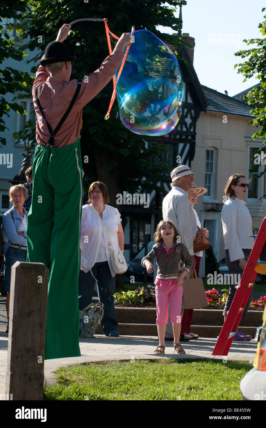 Stilt walker making bubbles at Ludlow Food Festival, Shropshire ...