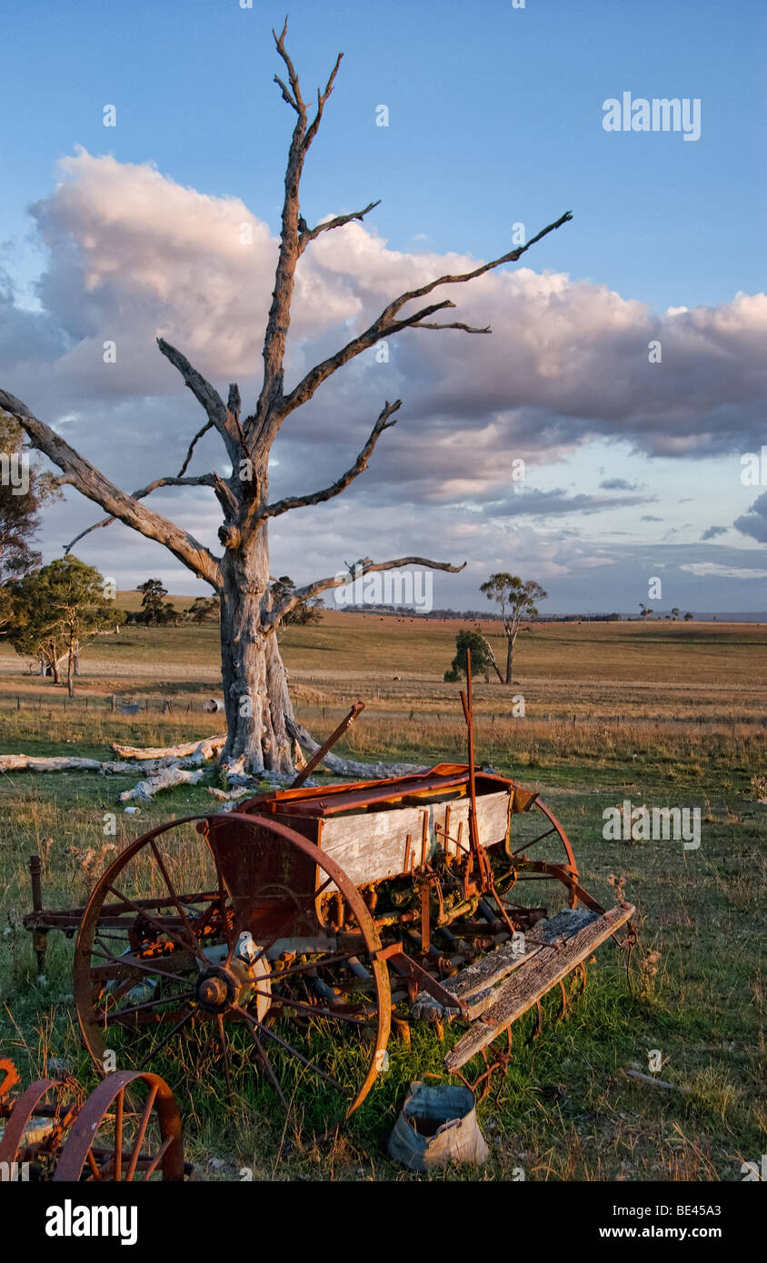 old farm machinery and equipment in the field Stock Photo - Alamy