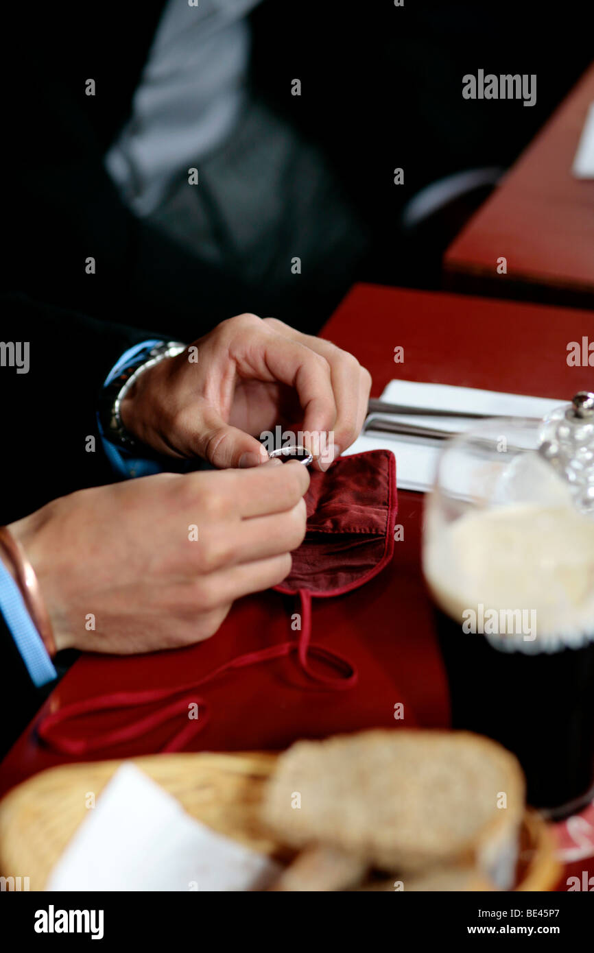 Usher holding a wedding ring during lunch in a public house Stock Photo ...