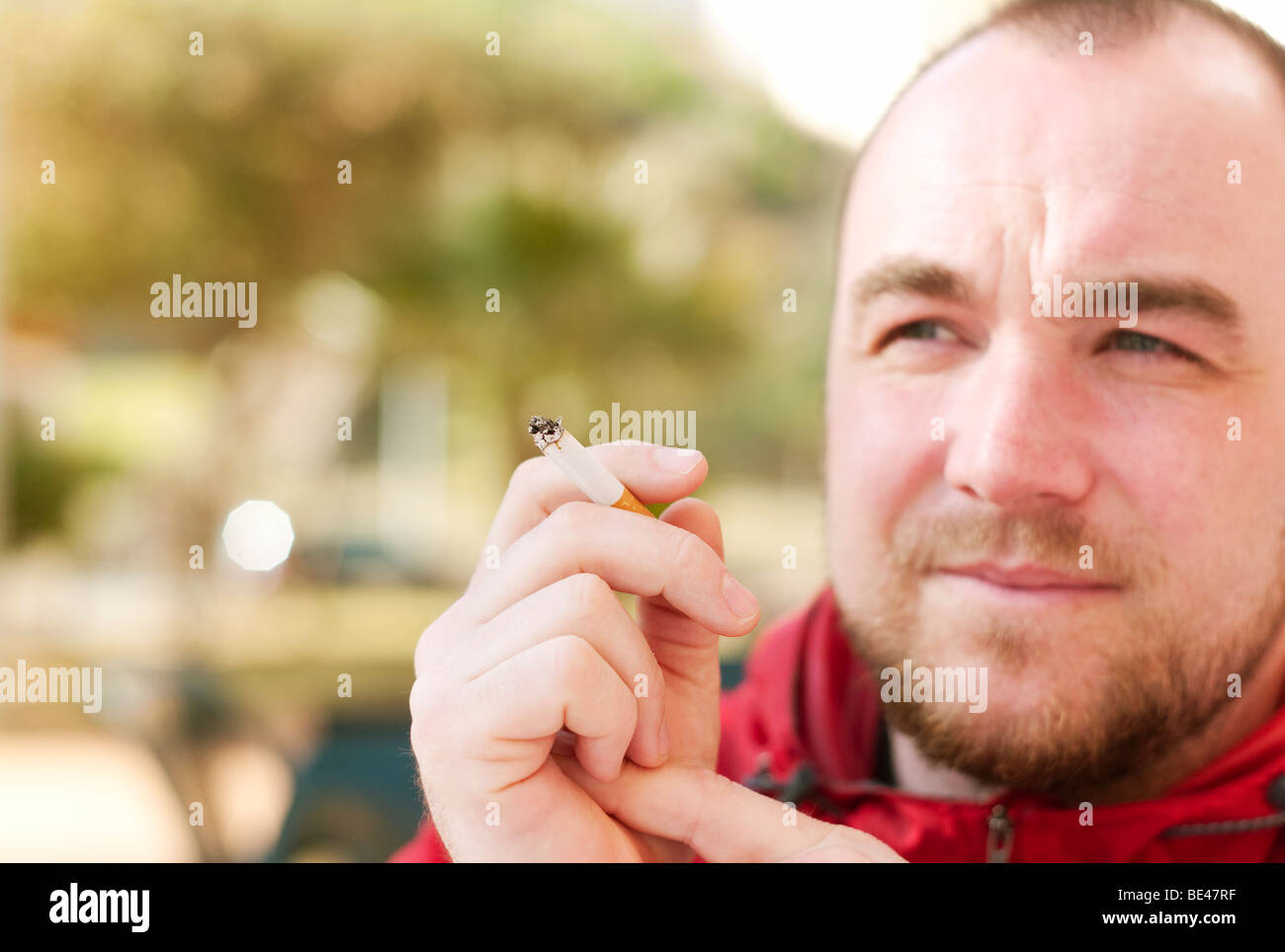 Man smoking cigarette office hi-res stock photography and images - Alamy