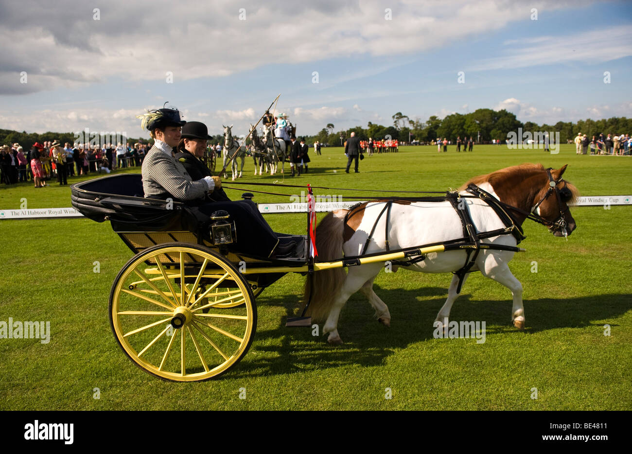 Two ladies on a small pony drawn carriage at carriage competition Stock ...