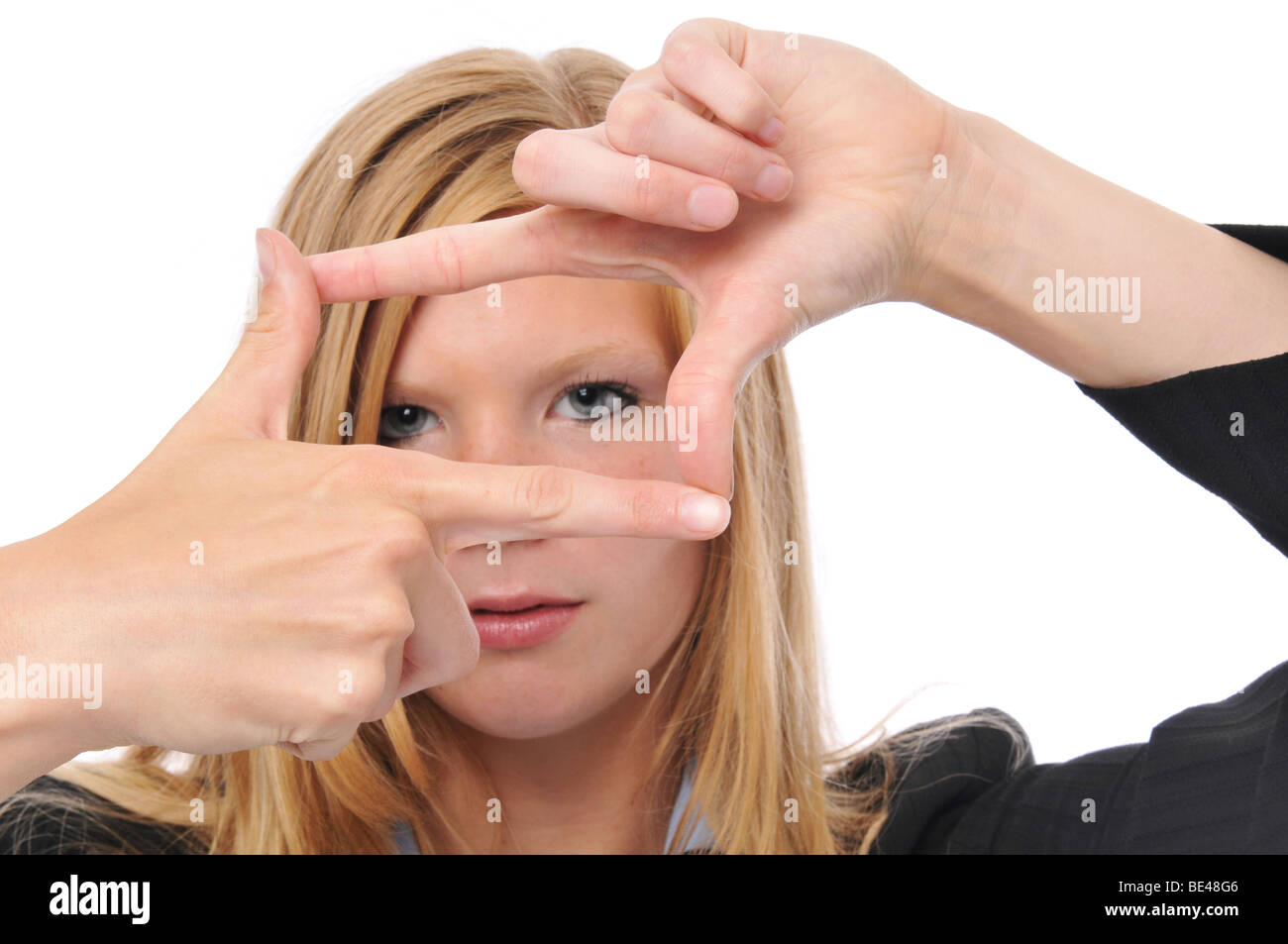 Beautiful blond with hands making a frame isolated on a white ...