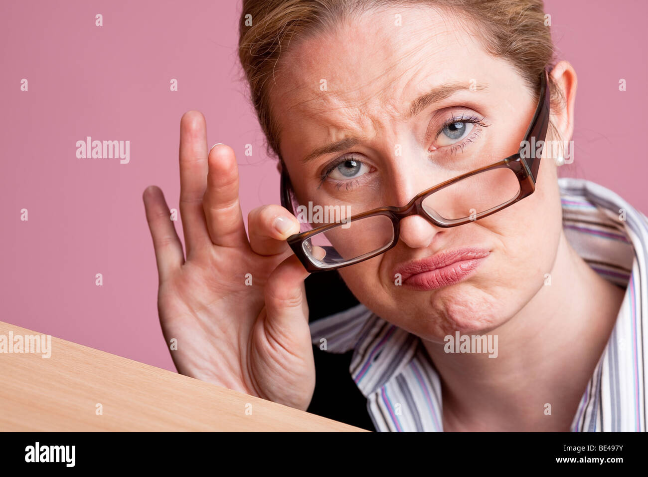 Woman Peering Over Glasses High Resolution Stock Photography and Images ...