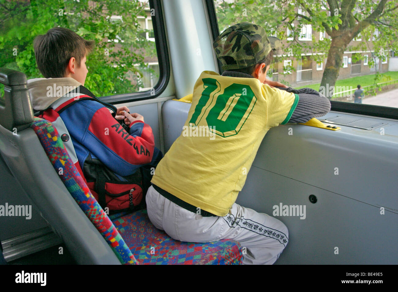 two young boys traveling through London by double-decker bus Stock ...