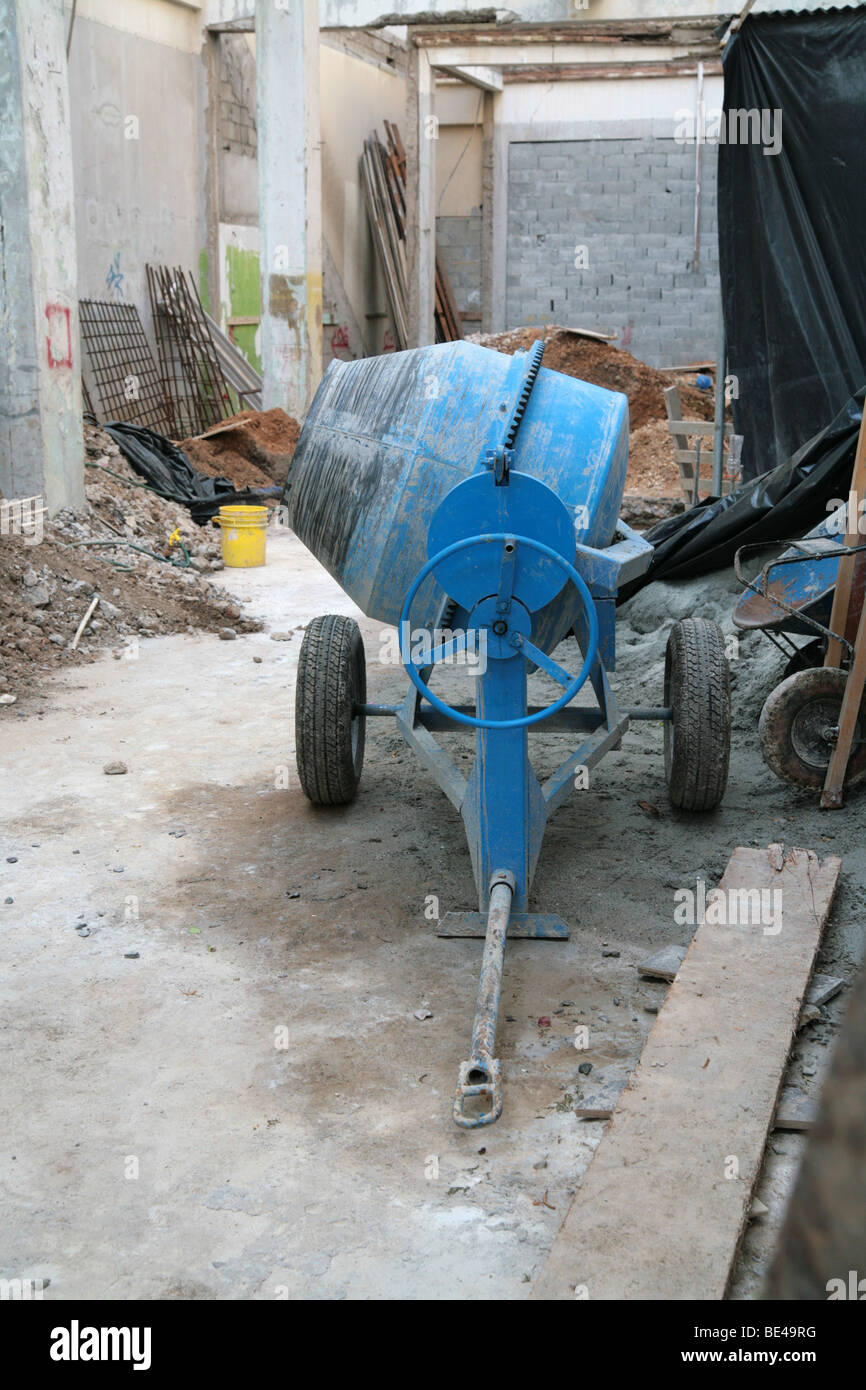 Blue concrete mixer at a construction site Stock Photo - Alamy