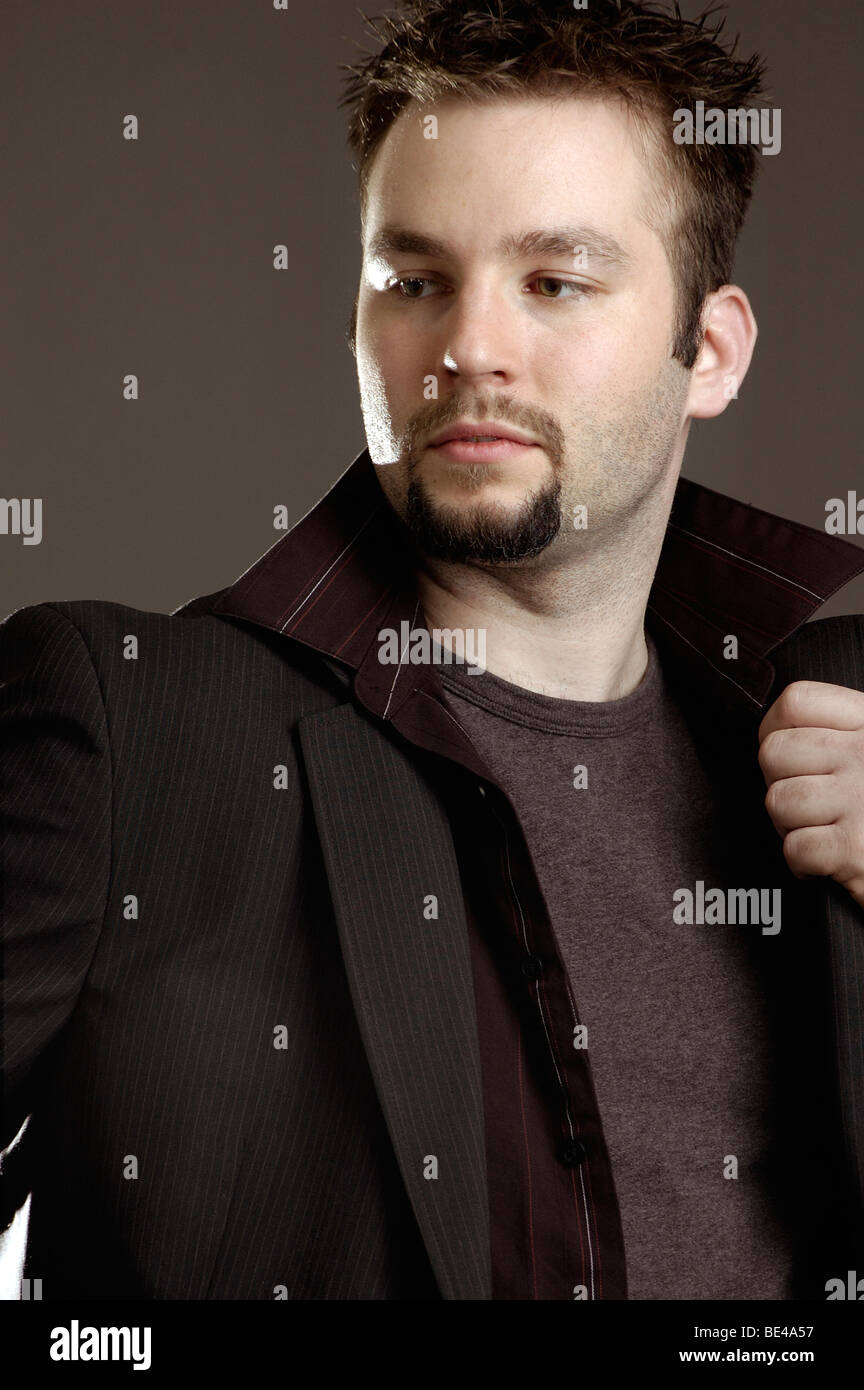 A casually dressed, fashionable man with collar up Stock Photo - Alamy