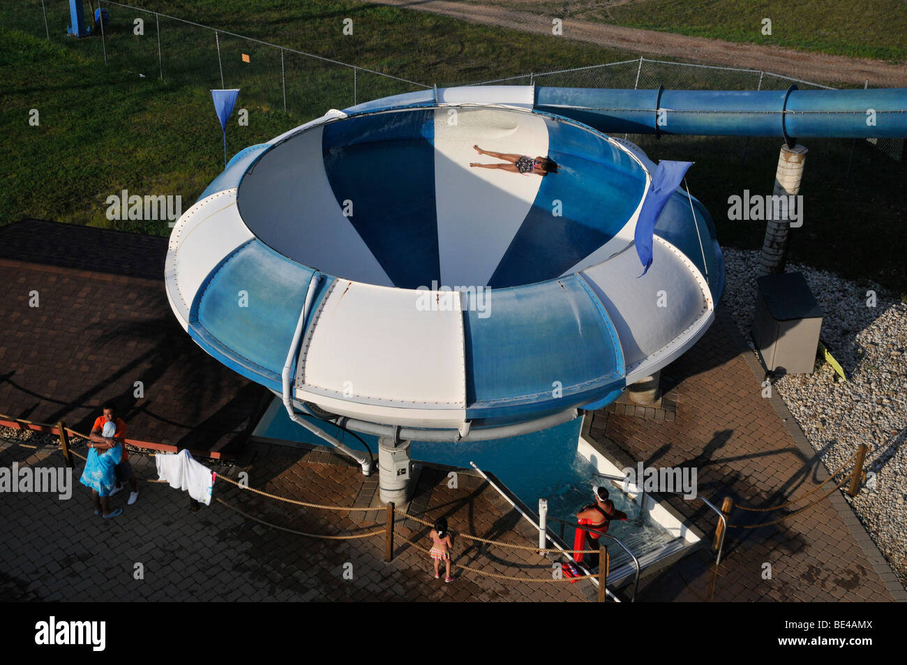 Kid inside of Vortex Bowl Slide Stock Photo - Alamy