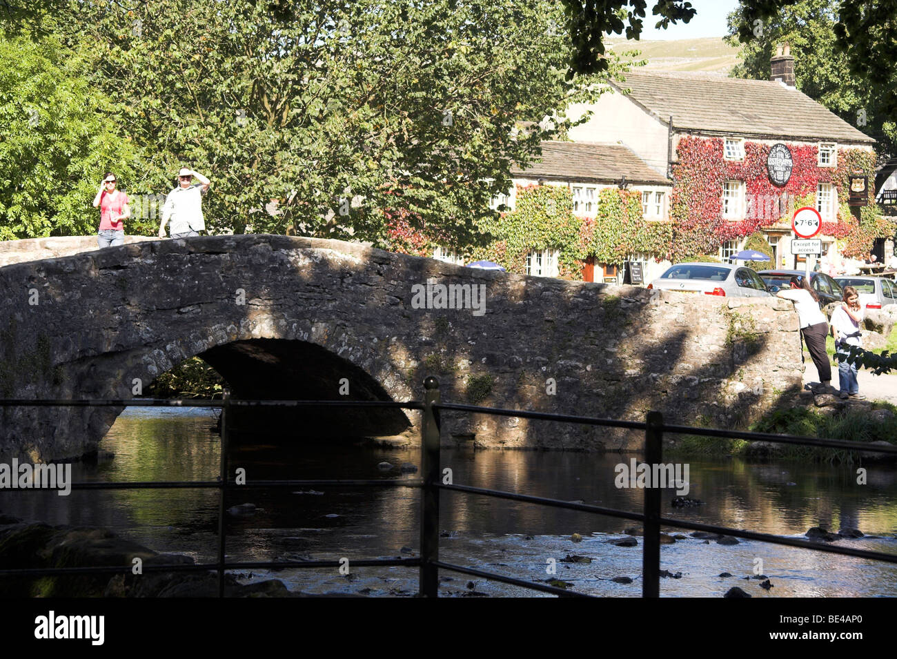 Bridge over Malham Beck, Lister Arms Hotel in the village of Malham ...