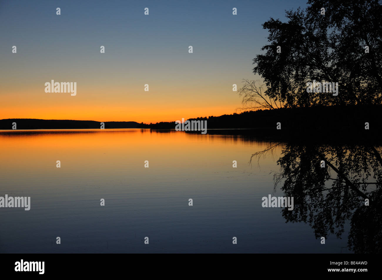 Quiet sunset on a lake. The picture is very relaxing Stock Photo - Alamy