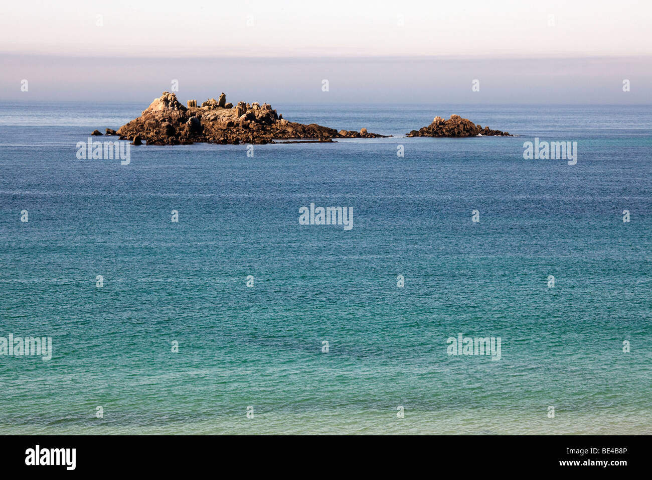 little rock island lost in blue sea, finistere, brittany, france Stock ...