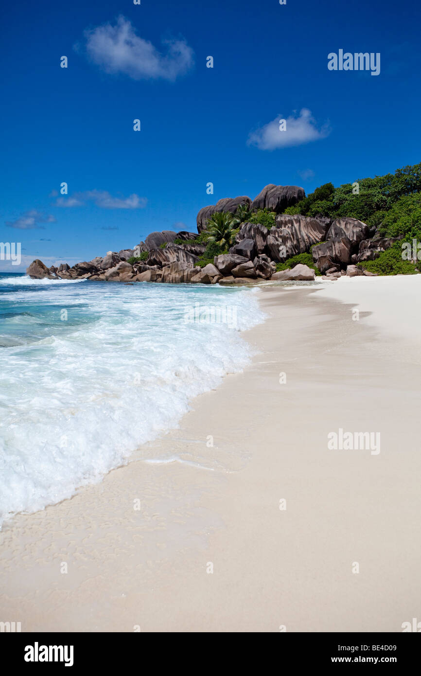 Lonely beach of Grand Anse, with the typical granite rocks of La Digue ...