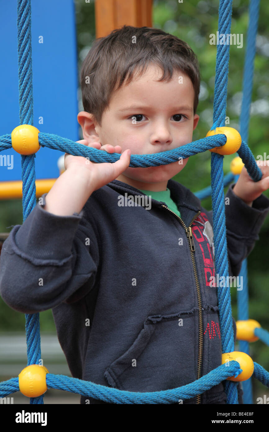 4 year old boy playing alone in Greenwich Park Stock Photo - Alamy