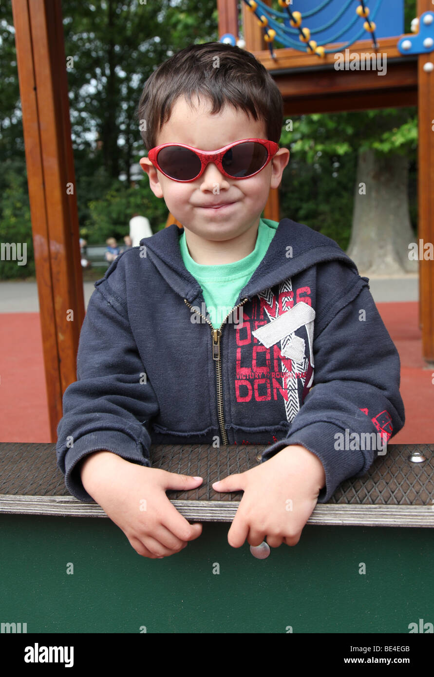 4 year old boy playing alone in Greenwich Park Stock Photo - Alamy