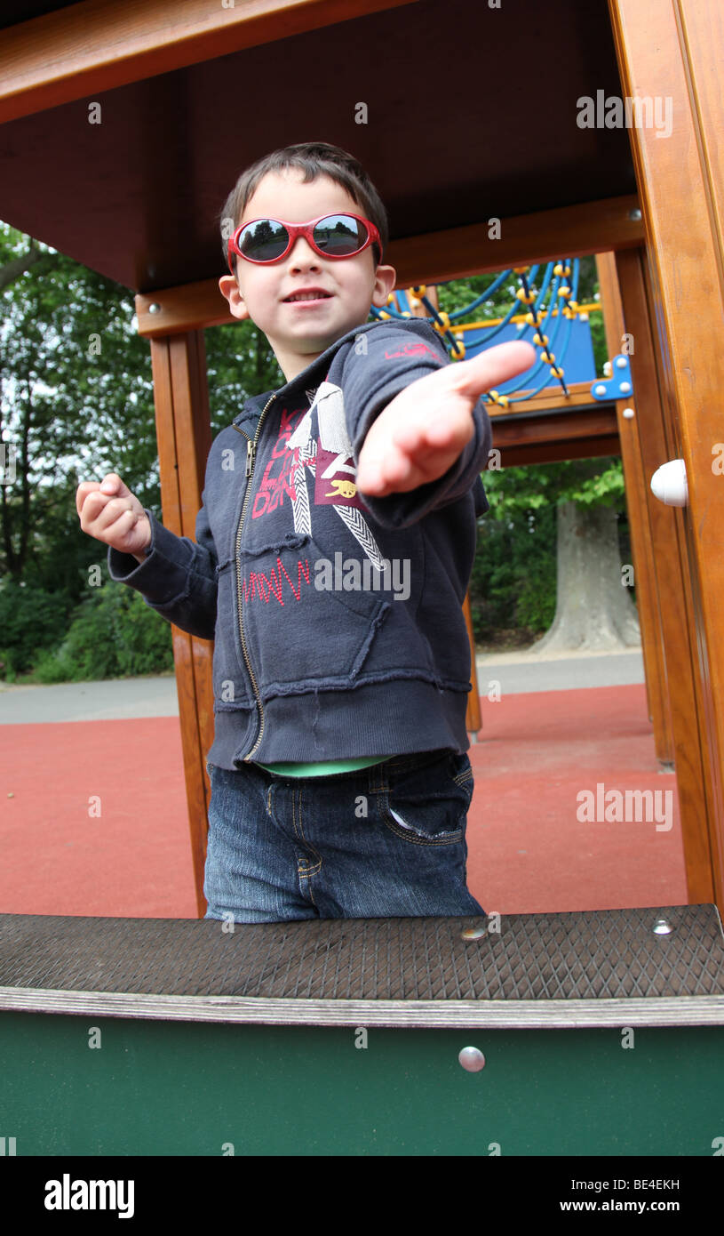 4 year old boy playing alone in Greenwich Park Stock Photo - Alamy