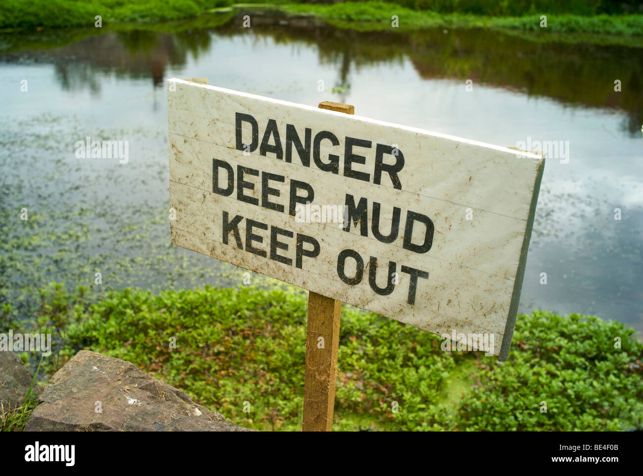 Danger warning sign next to a village pond Stock Photo - Alamy