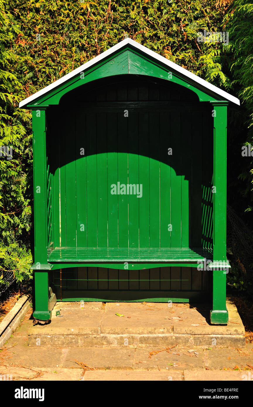 Bench shelter in formal garden Stock Photo - Alamy