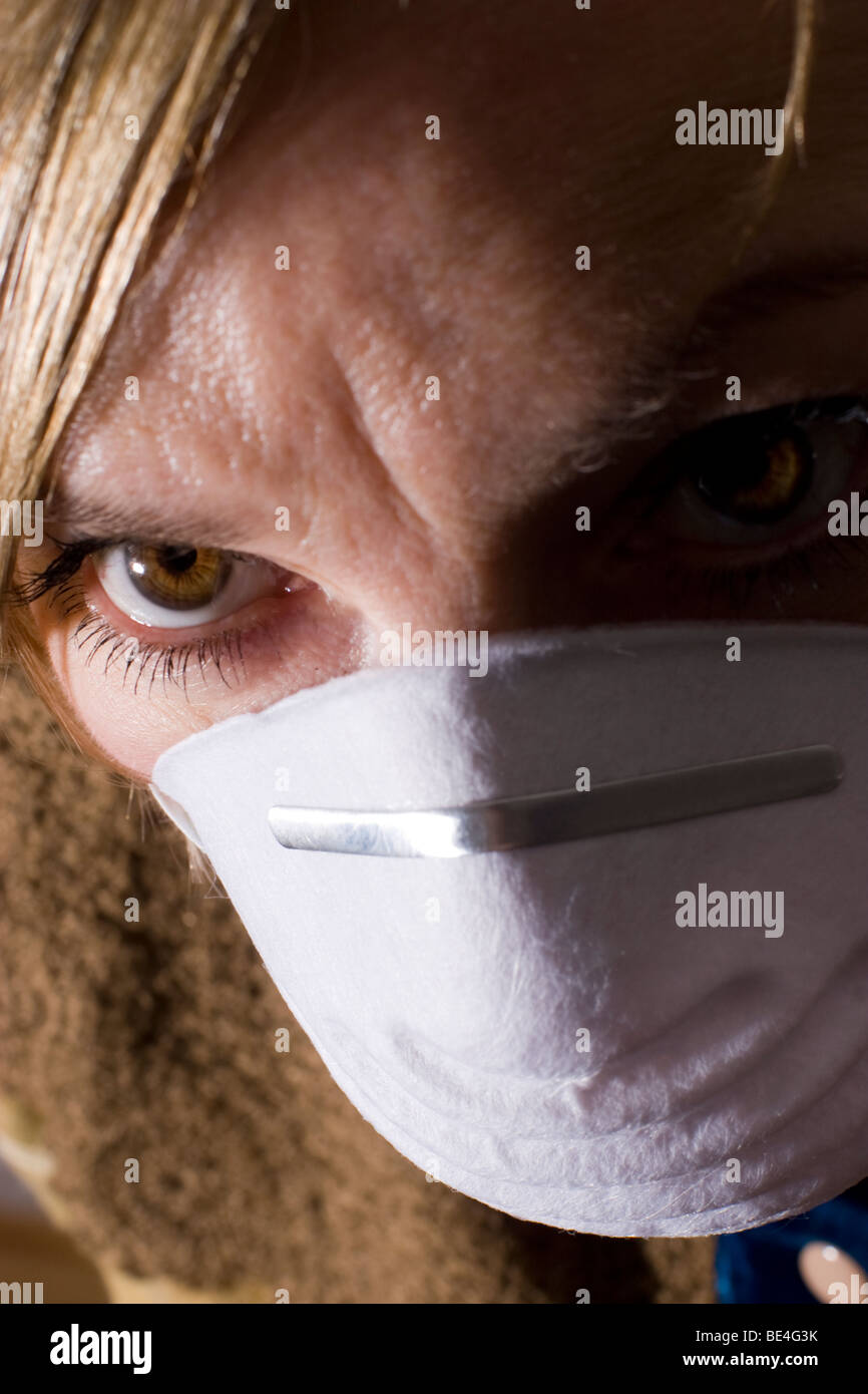woman wearing a PPE mask for protection against COVID-19 and flu Stock ...
