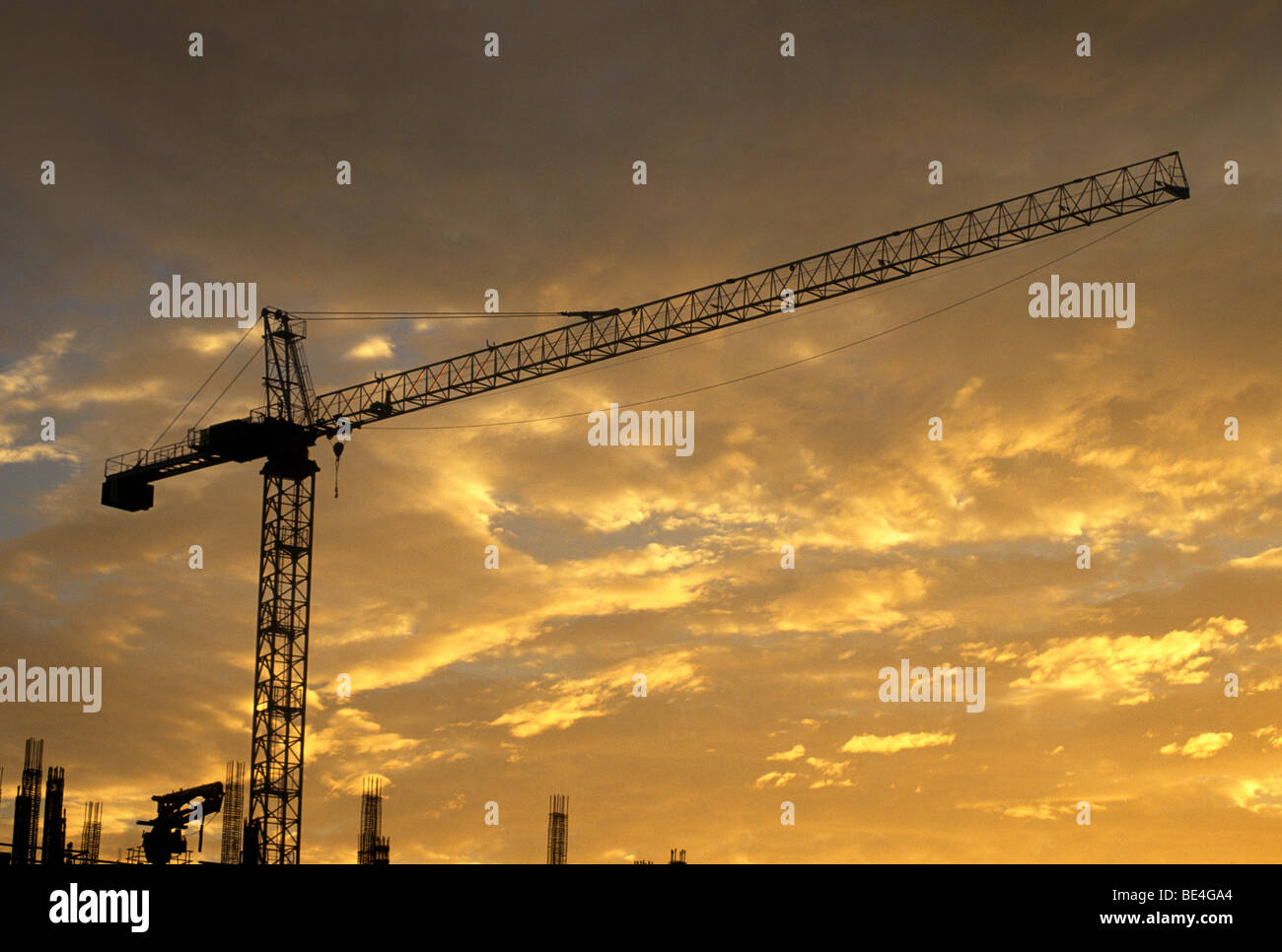 Construction crane at sunset Stock Photo - Alamy