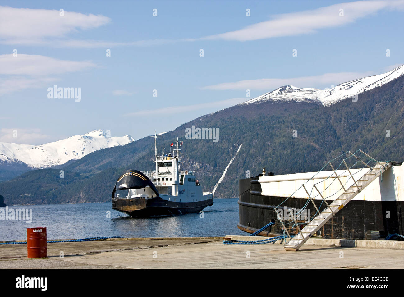 Small ferry comes in to dock at Eidsdal, a small village along ...