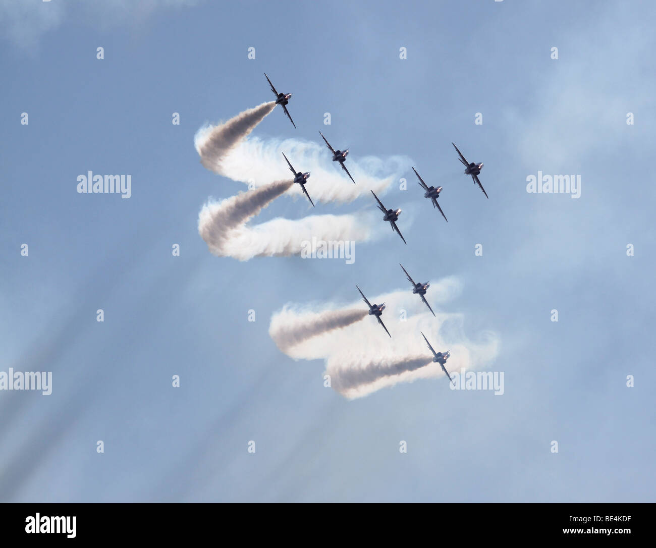 aerobatics team flying in formation with smoke Stock Photo - Alamy