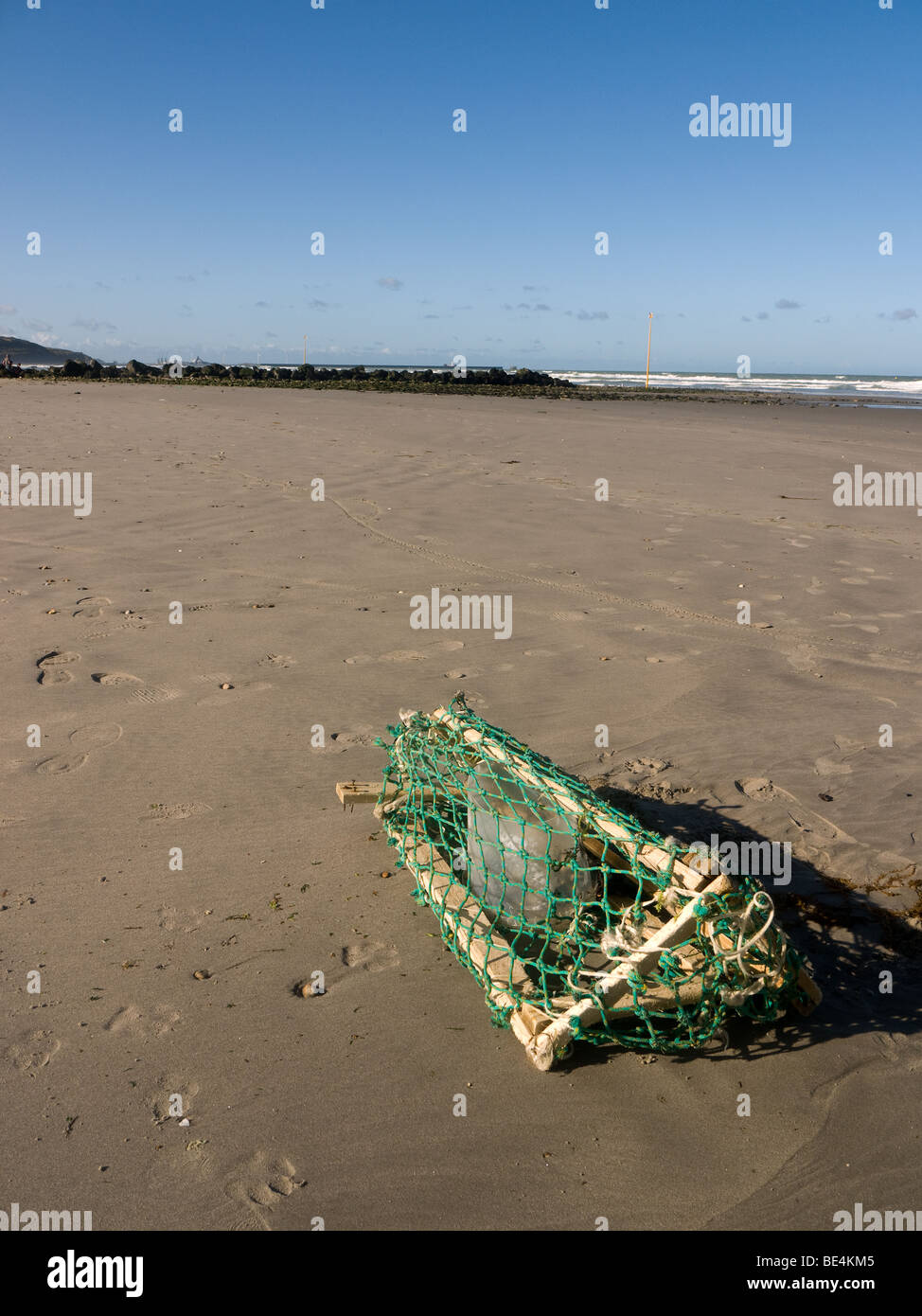 An abandoned fishing net on the empty beach Stock Photo - Alamy
