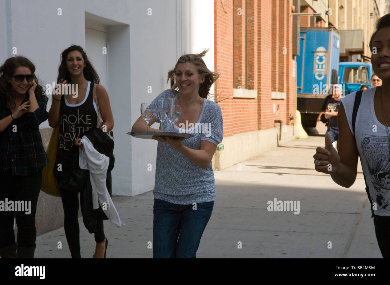 A waitress from Abe & Arthur's restaurant competes in their waiter ...