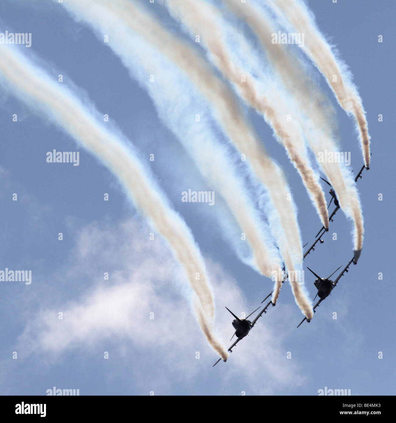 aerobatics team flying in formation with smoke Stock Photo - Alamy