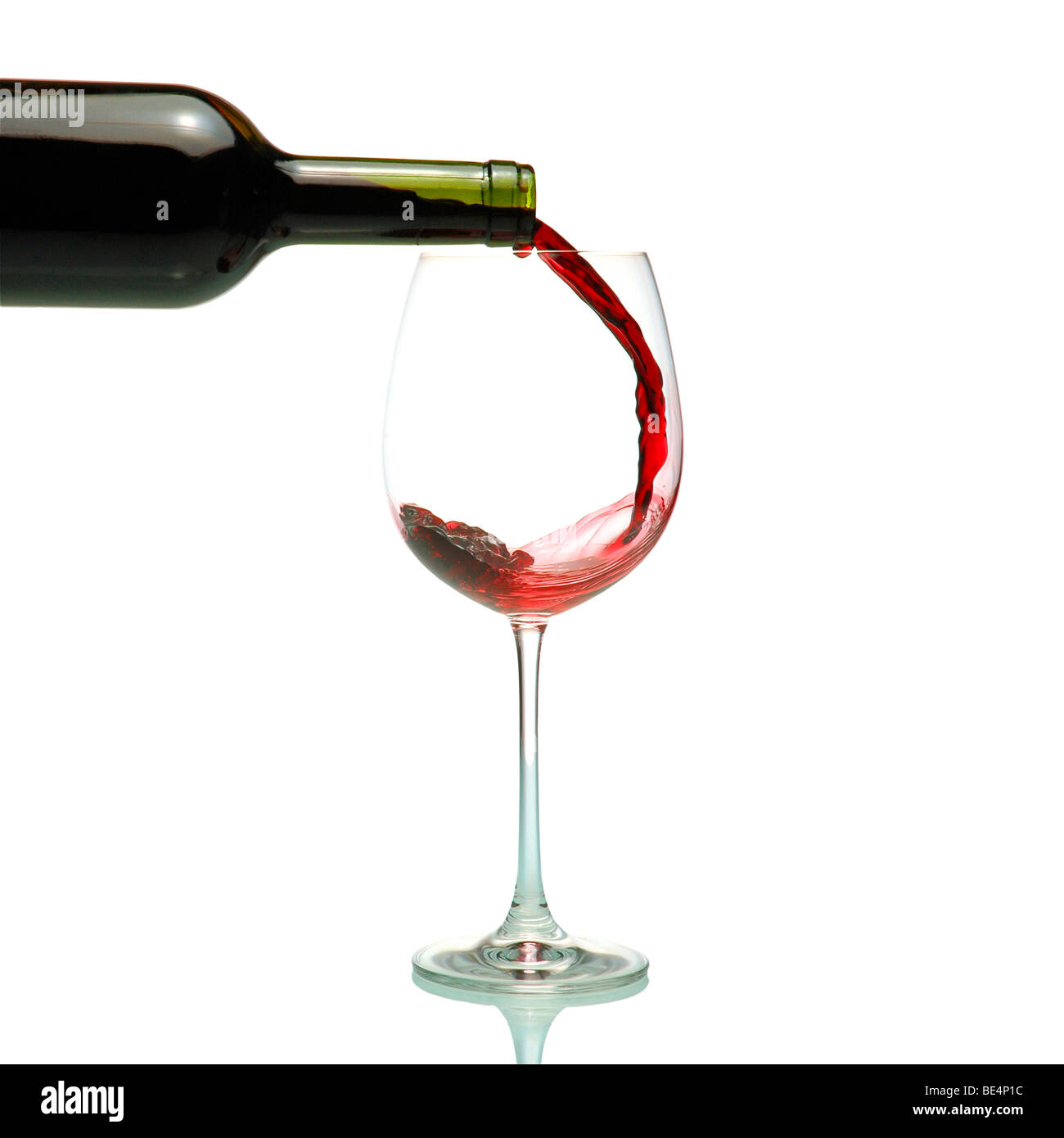 Red wine being poured into a wine glass Stock Photo - Alamy