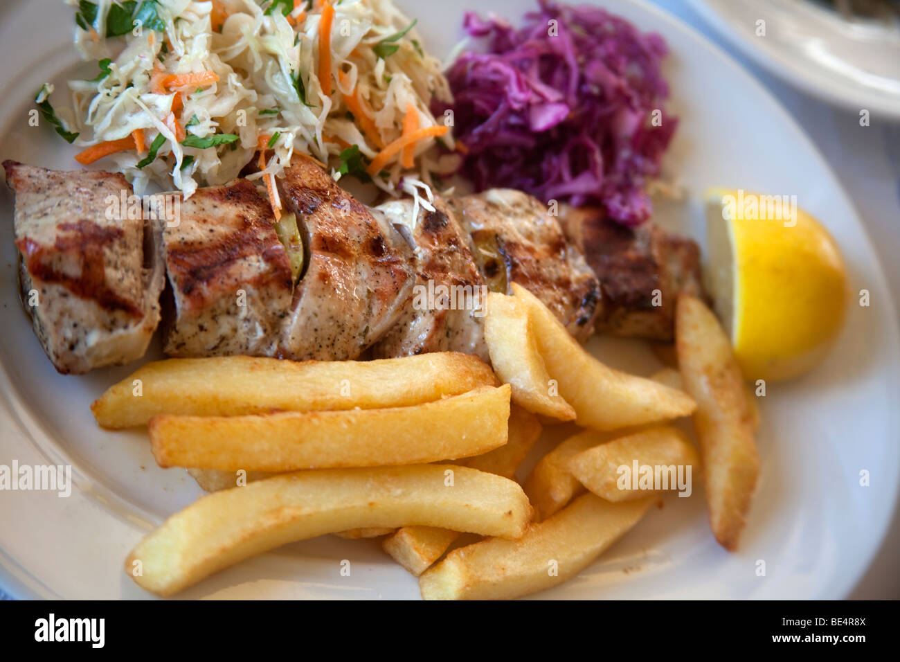 Greek,traditional food,souvlaki,with potatoes,lemon and salad Stock ...