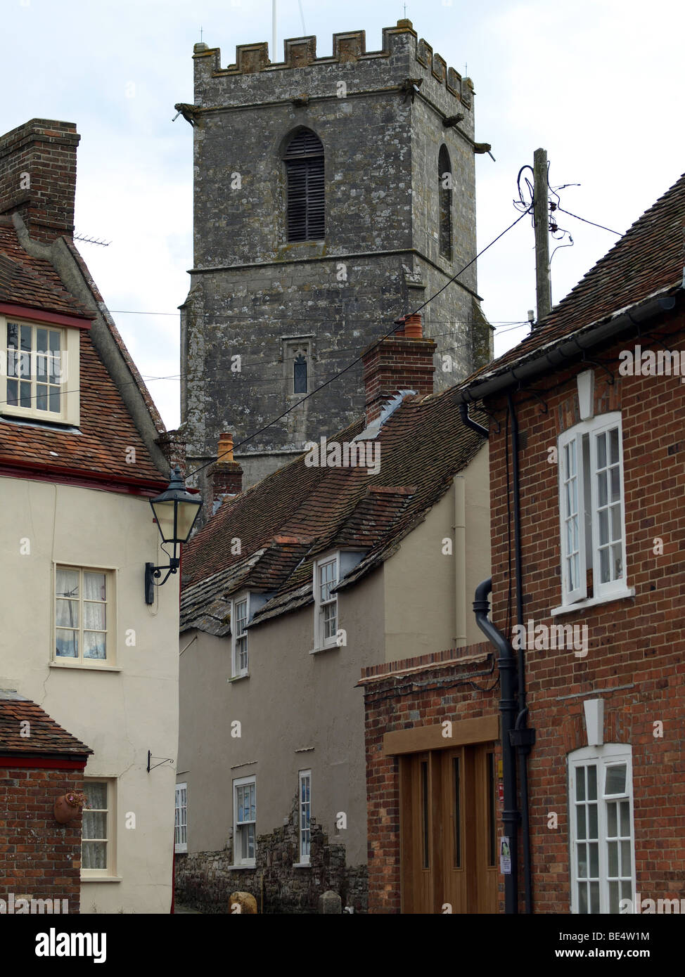 A narrow street and church bell-tower at Wareham,Dorset Stock Photo - Alamy