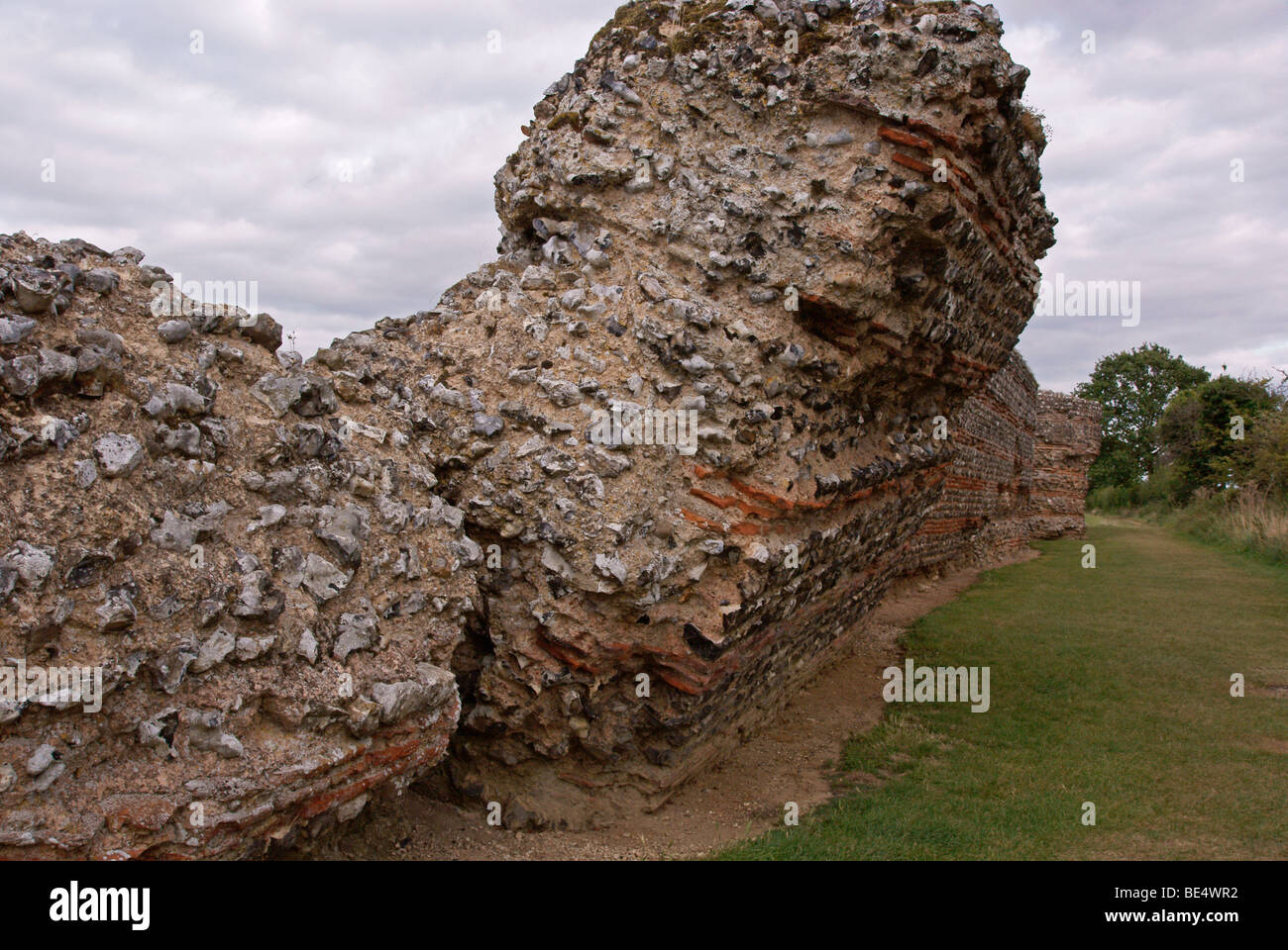The falling south wall of Burgh Castle old Roman fort Stock Photo - Alamy