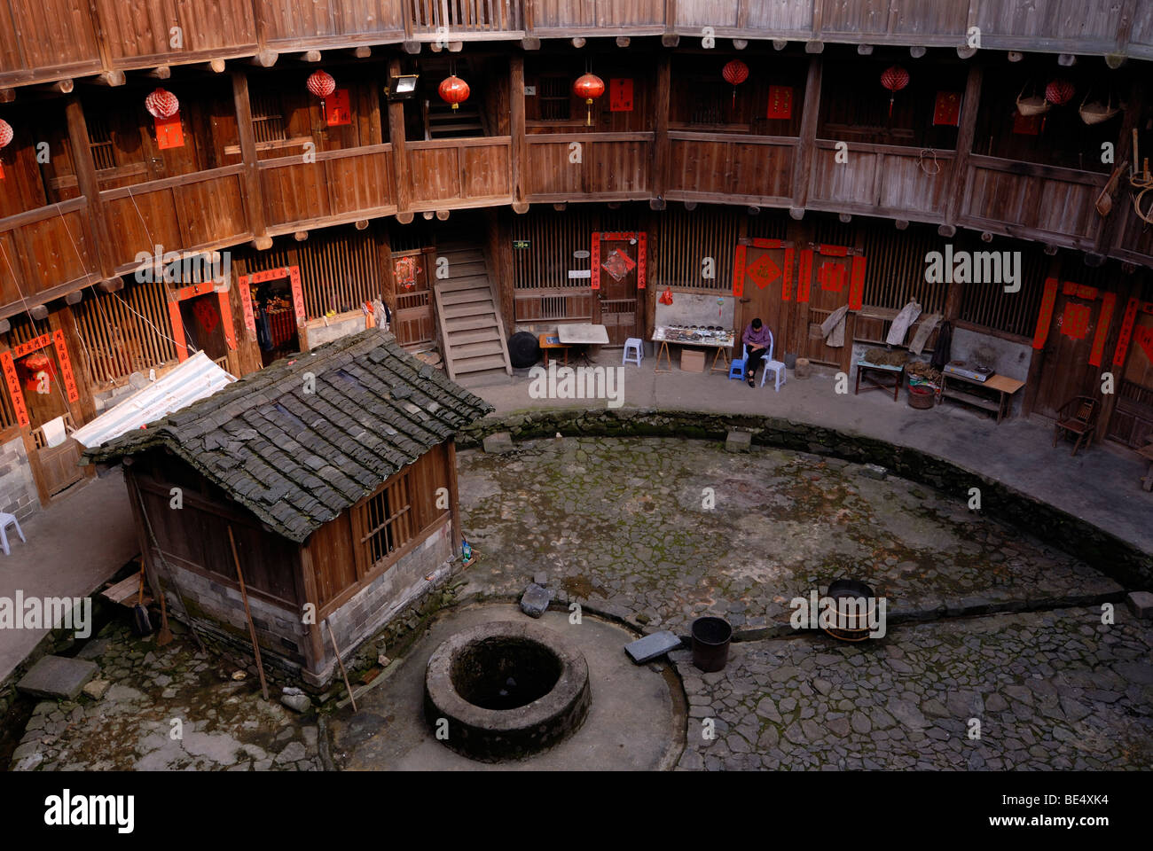 Courtyard with a fountain of a Tulou round house, dirt round houses ...