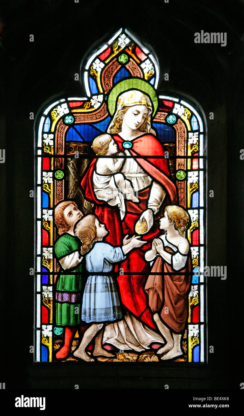 A Stained Glass Window Depicting Saint Charity, St John the Evangelist ...